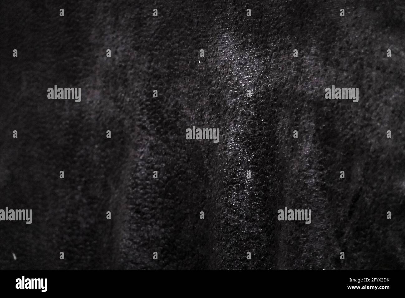 a rough uneven black surface with white parts Stock Photo - Alamy