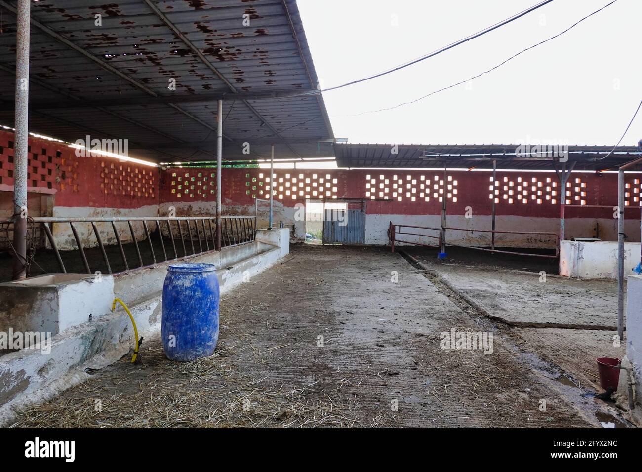 an enclosed animal farm with red walls Stock Photo - Alamy