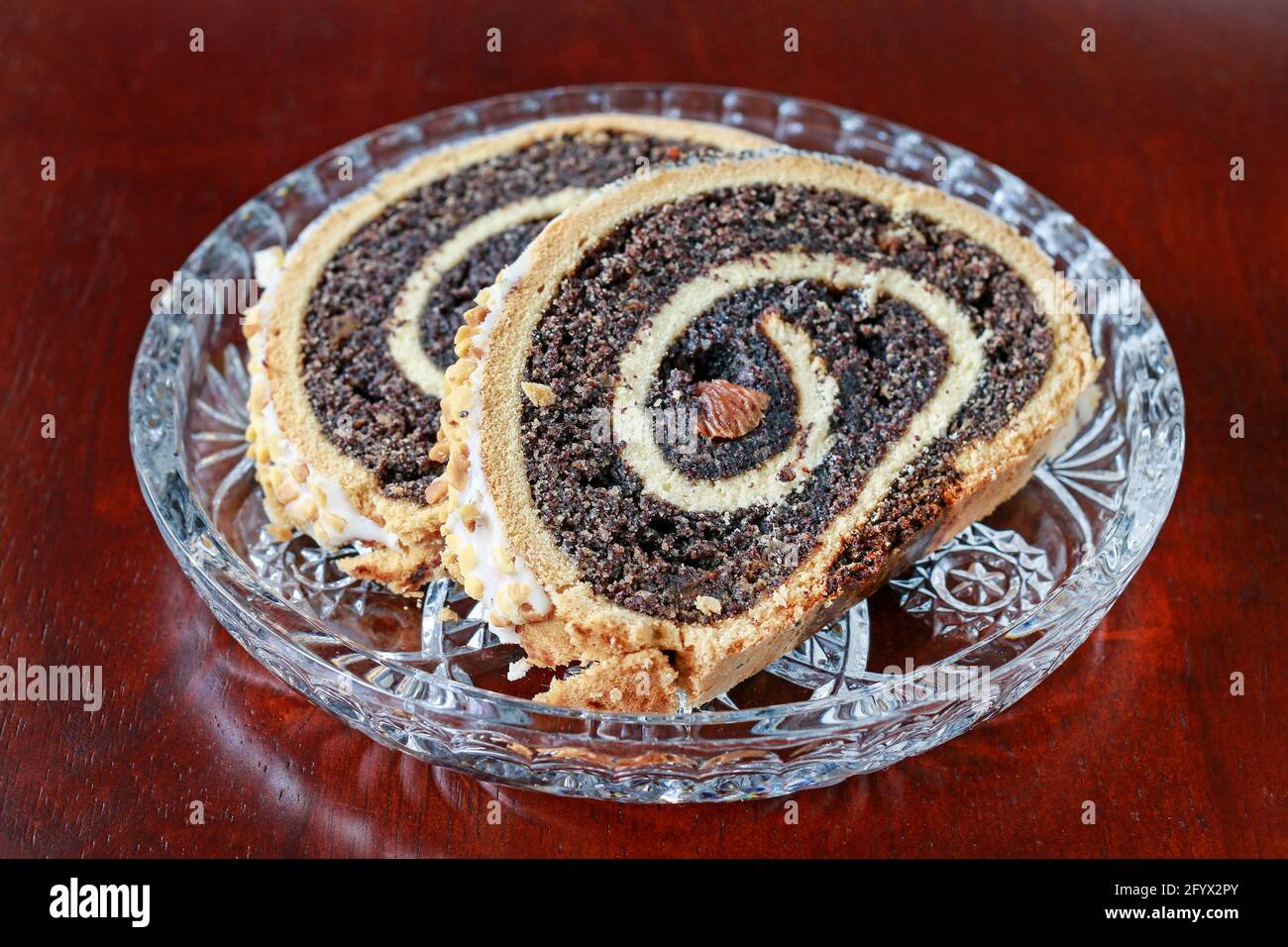 Slices of poppy-seed christmas cake. Party dessert Stock Photo - Alamy