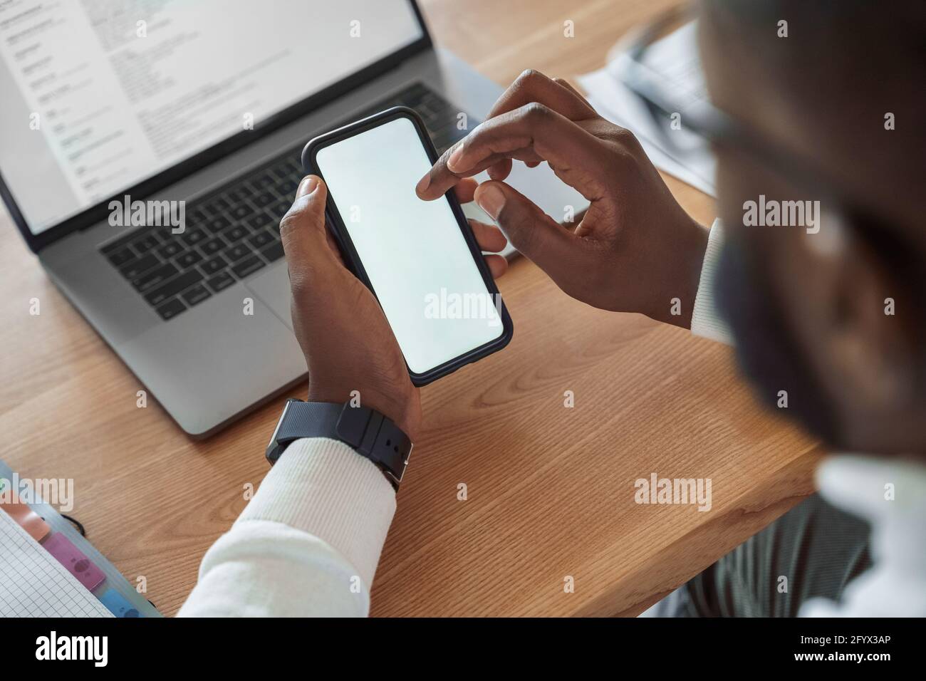 Closeup african american male hand swiping on mobile phone screen ...