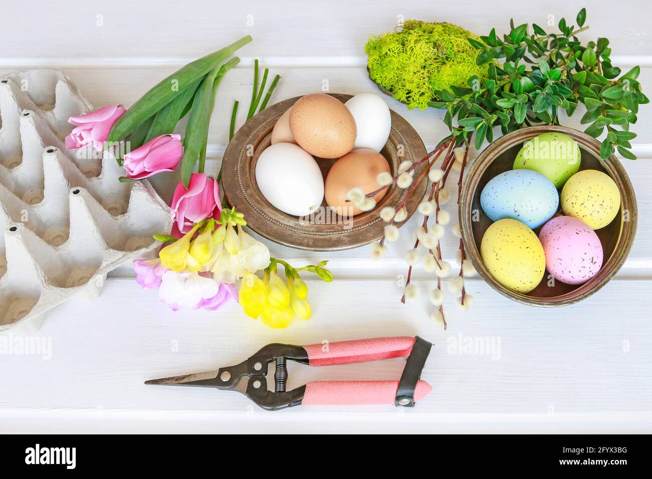 Florist at work: woman shows how to make Easter floral decoration with ...