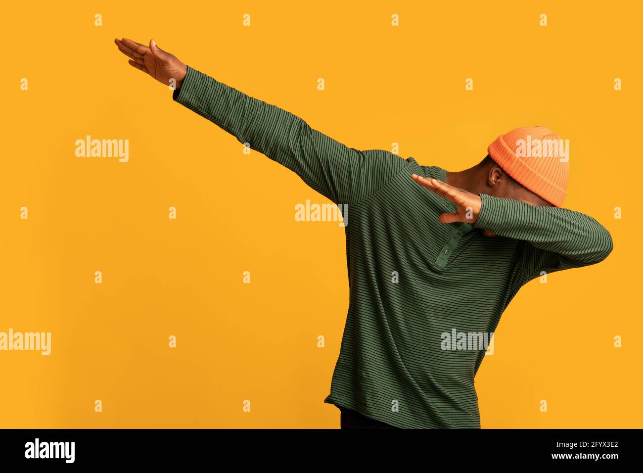 Black Hipster Guy Throwing Dab Move Over Orange Studio Background Stock ...