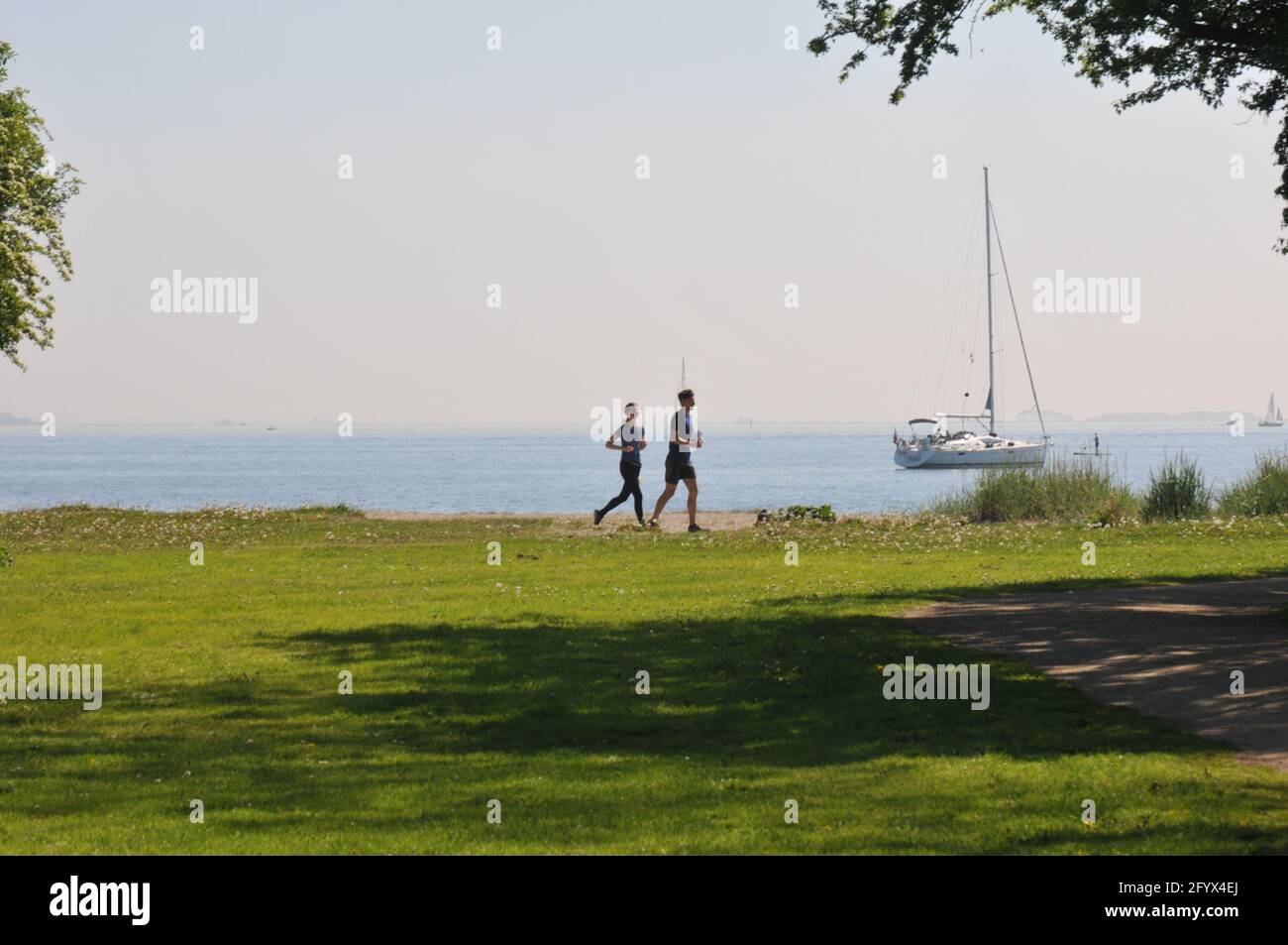 Copenhagen, Denmark. 30 May 2021, People walk and sun bath on Amager ...