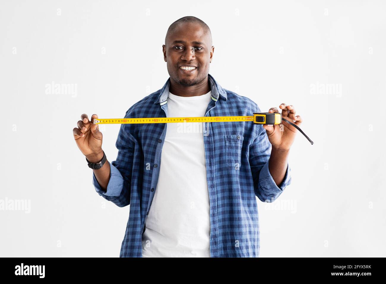 Millennial black man measuring hi-res stock photography and images - Alamy