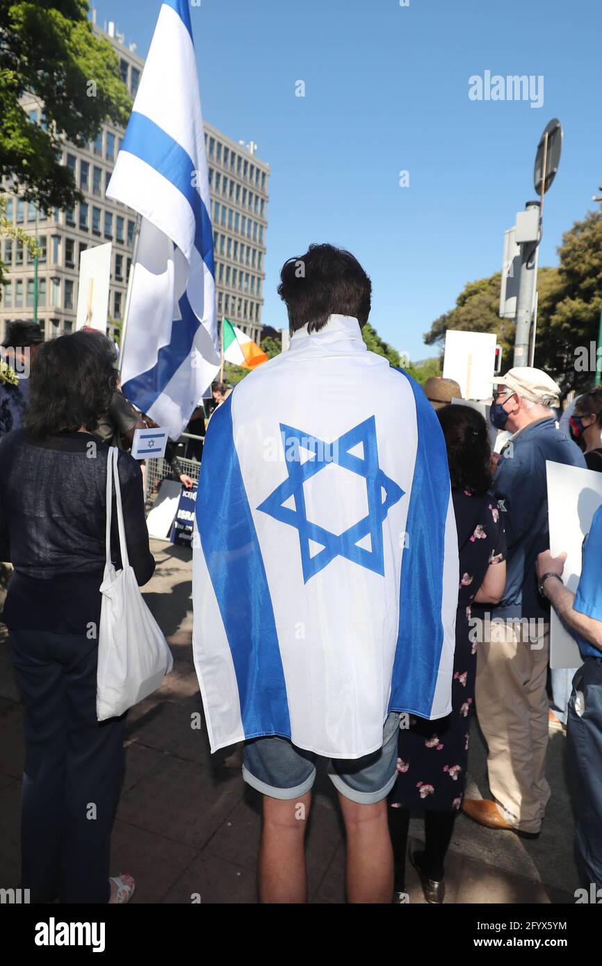 A man draped in a flag during a solidarity rally organised by the Irish ...