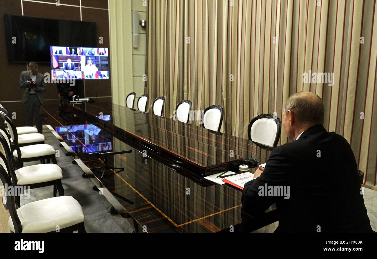 Russian President Vladimir Putin hosts a video conference meeting with ...