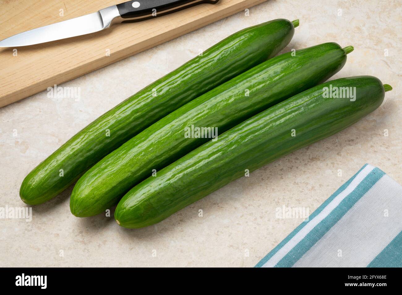 Whole fresh green cucumbers ready to cut and cook Stock Photo - Alamy