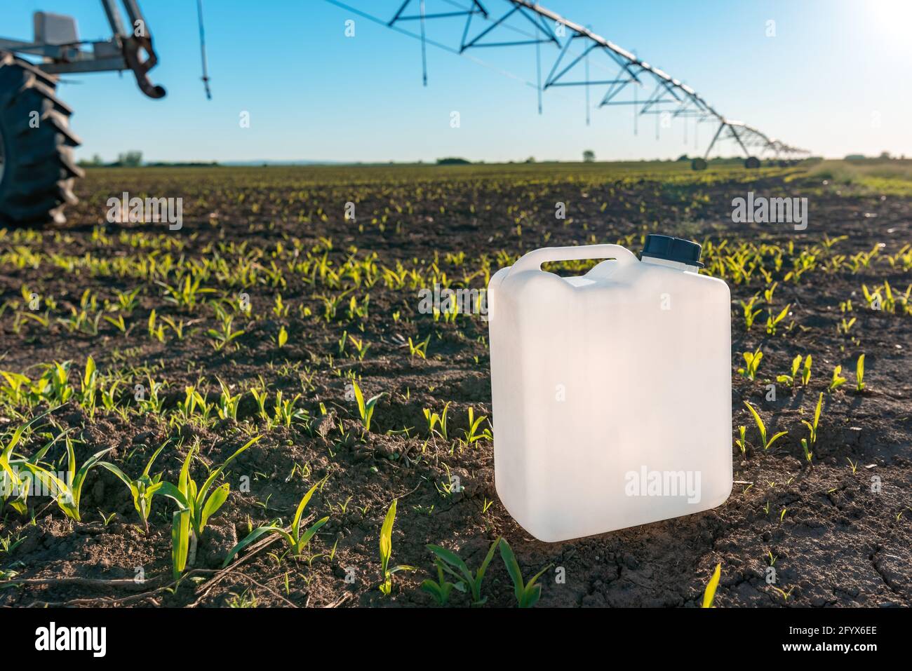 Herbicide canister can in corn field, crop protection concept Stock ...