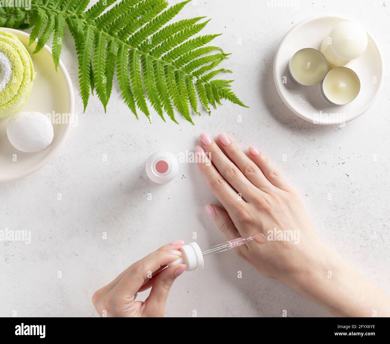 Woman applying retinol serum drop hi-res stock photography and images ...