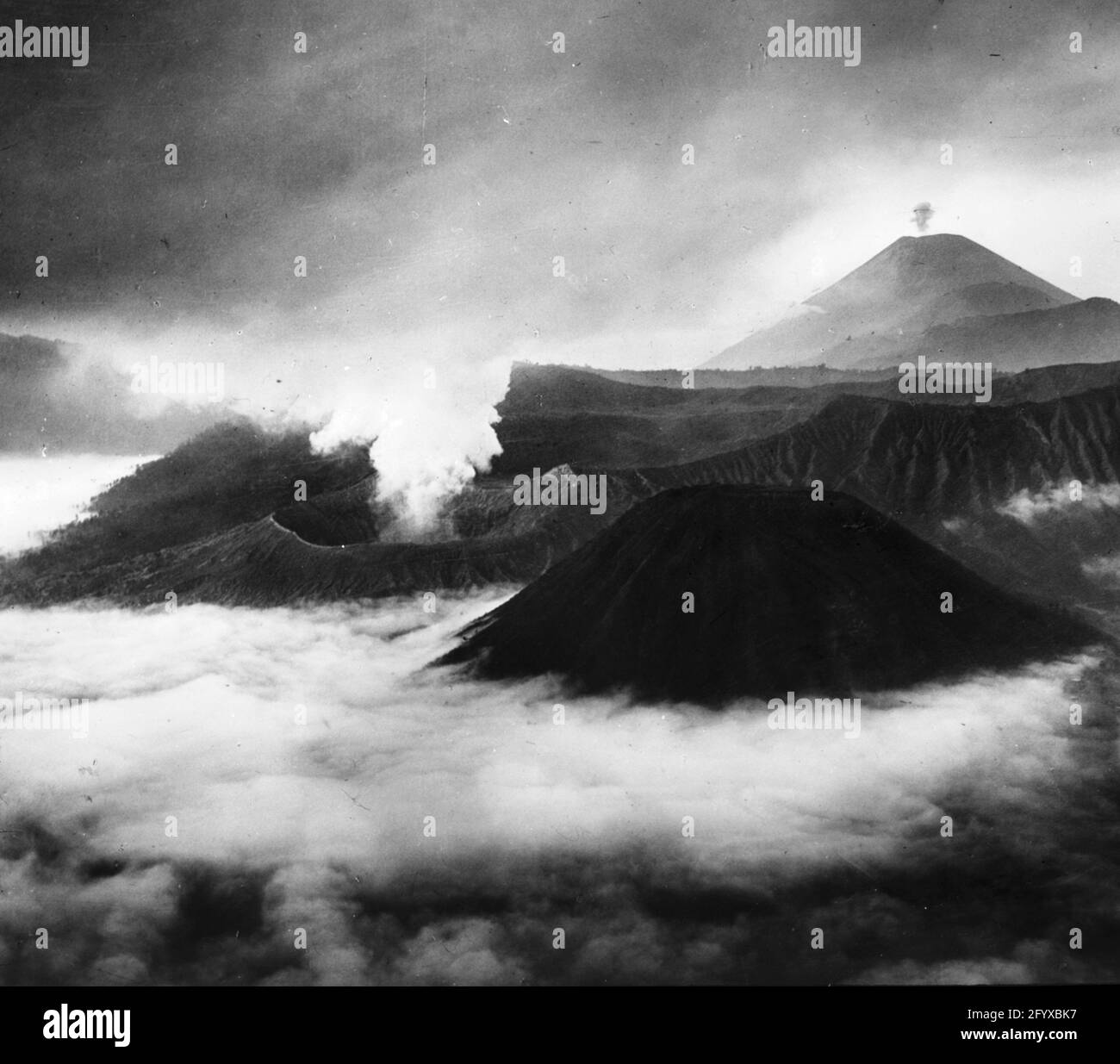 Volcanic Range With Smoke, Asia Stock Photo - Alamy