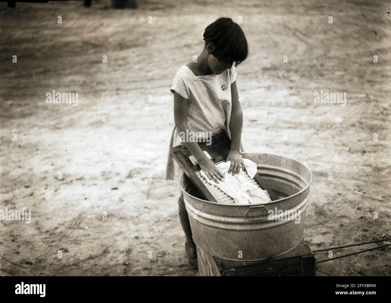 Child Washing Clothes in Tourist Camp, Florida, ca 1930 Stock Photo - Alamy