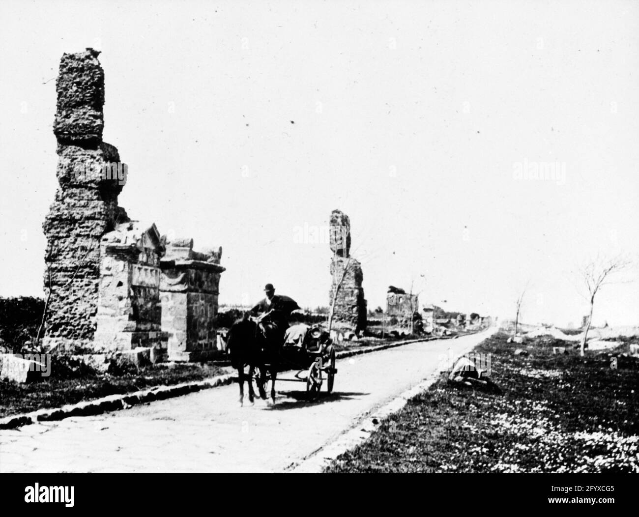 A horse-drawn carriage travels on the Appian Way outside Rome, Italy ...