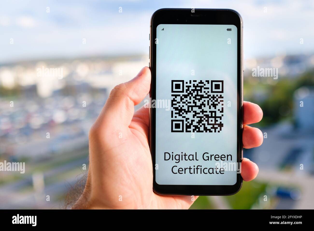 Digital Green Certificate with QR code on the screen of mobile phone in ...