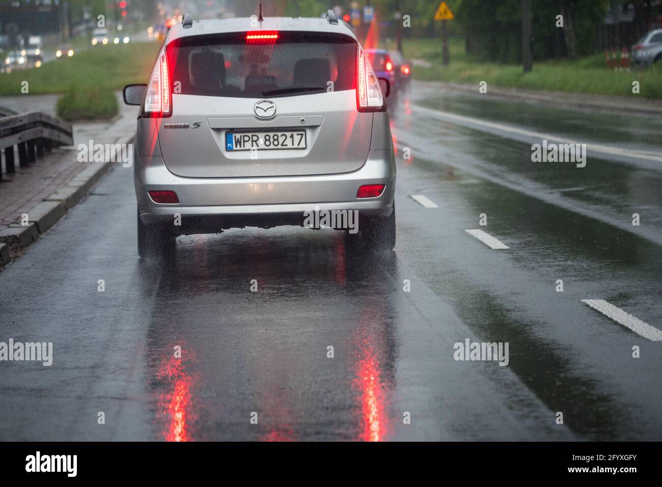 Warsaw, Poland - May 19, 2021: Cars in the rain. Traffic in the city in ...