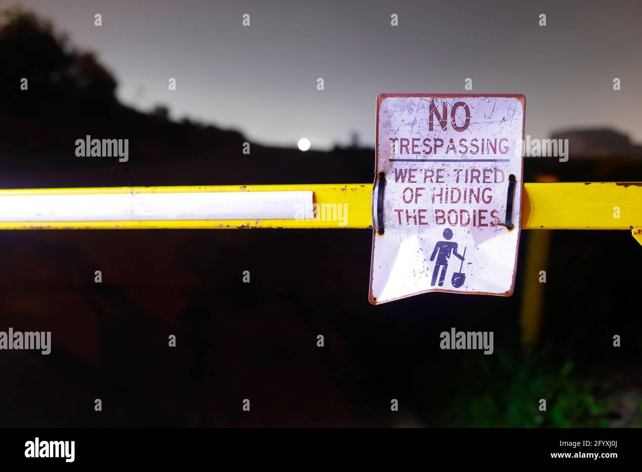 A humorous sign warning people not to trespass. The sign reads 'No ...