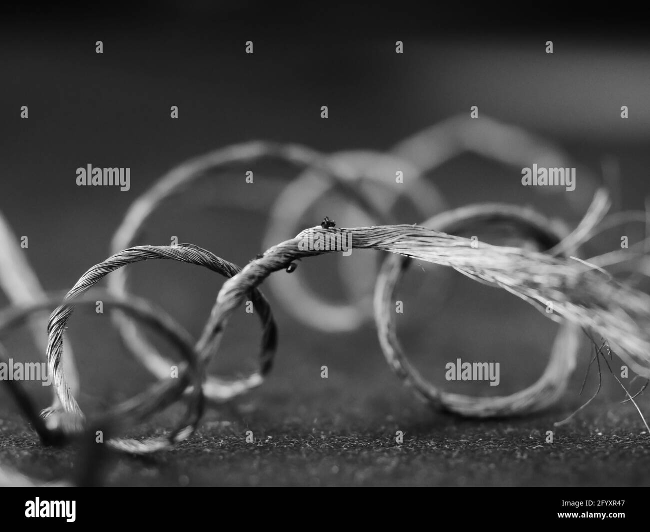 A dramatic grayscale of metal cable wire details on blurred background ...