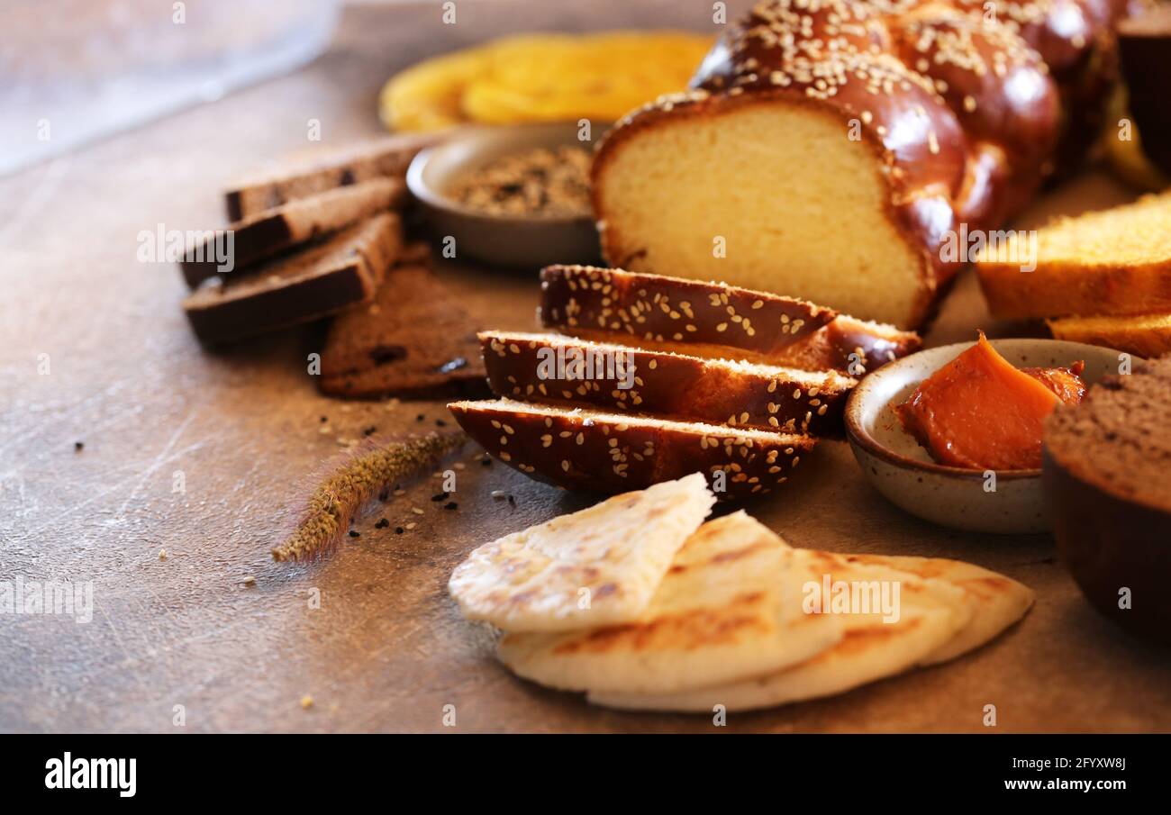 bread assortment on the table rustic style Stock Photo - Alamy