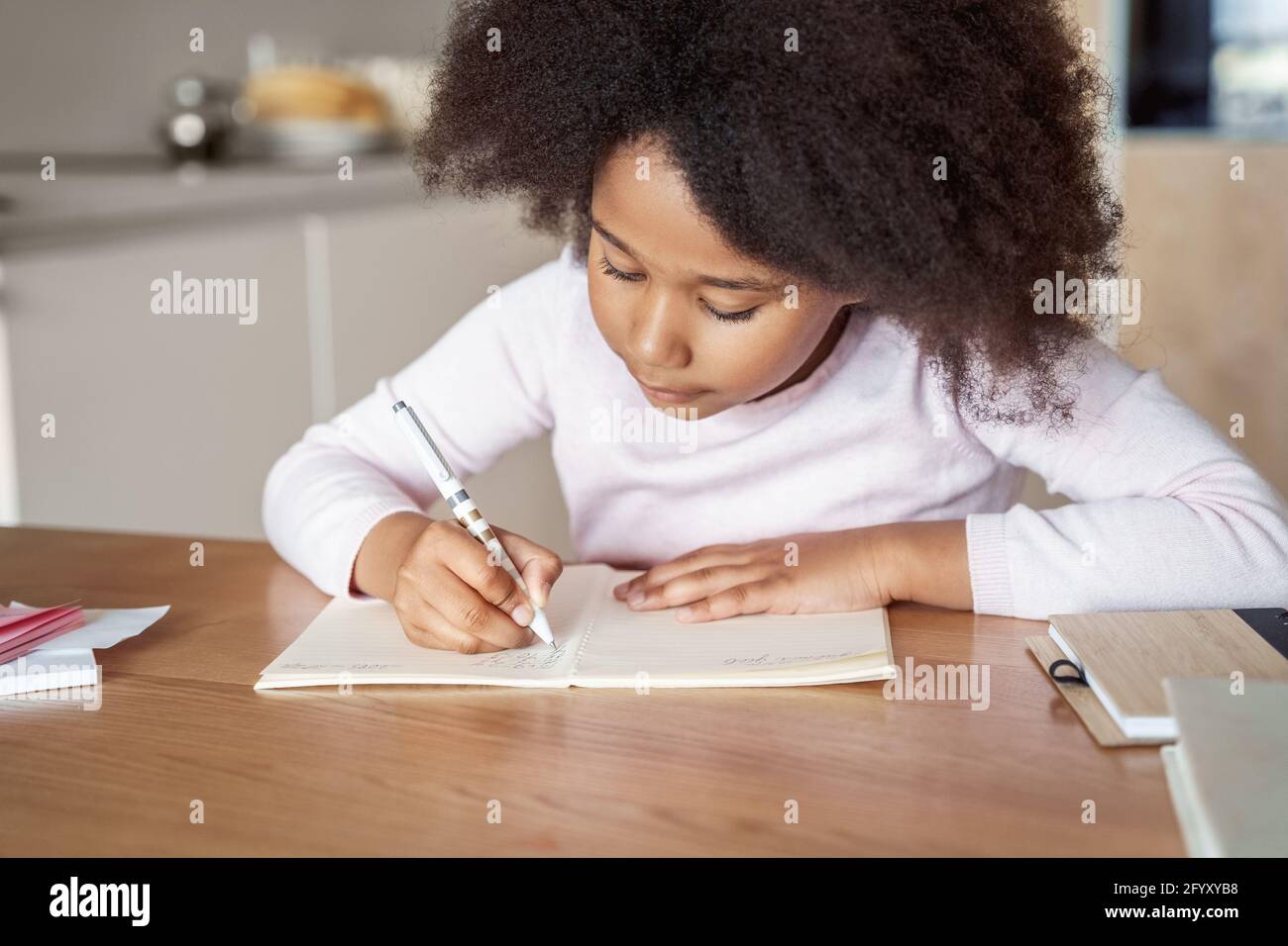 African school child in school writing hi-res stock photography and ...