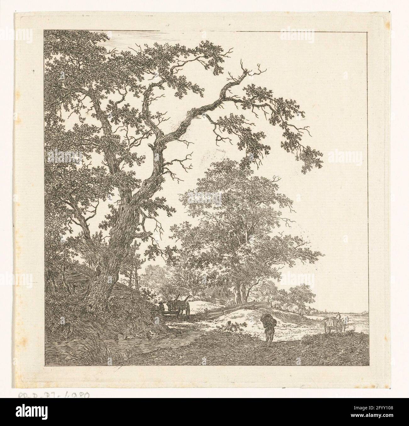 Crossing sand path with carts and man with suit on his back Stock Photo ...