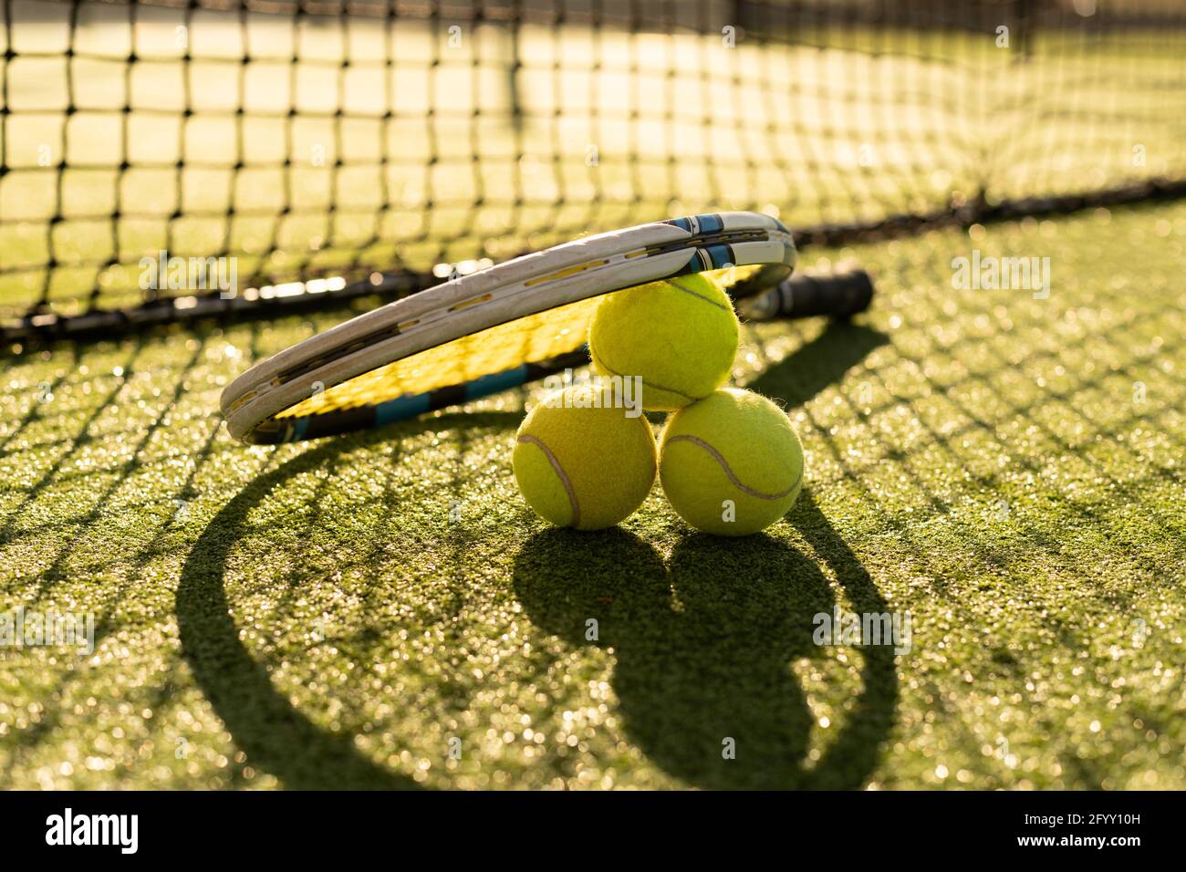 Close up view of two tennis rackets and balls on the tennis court Stock ...