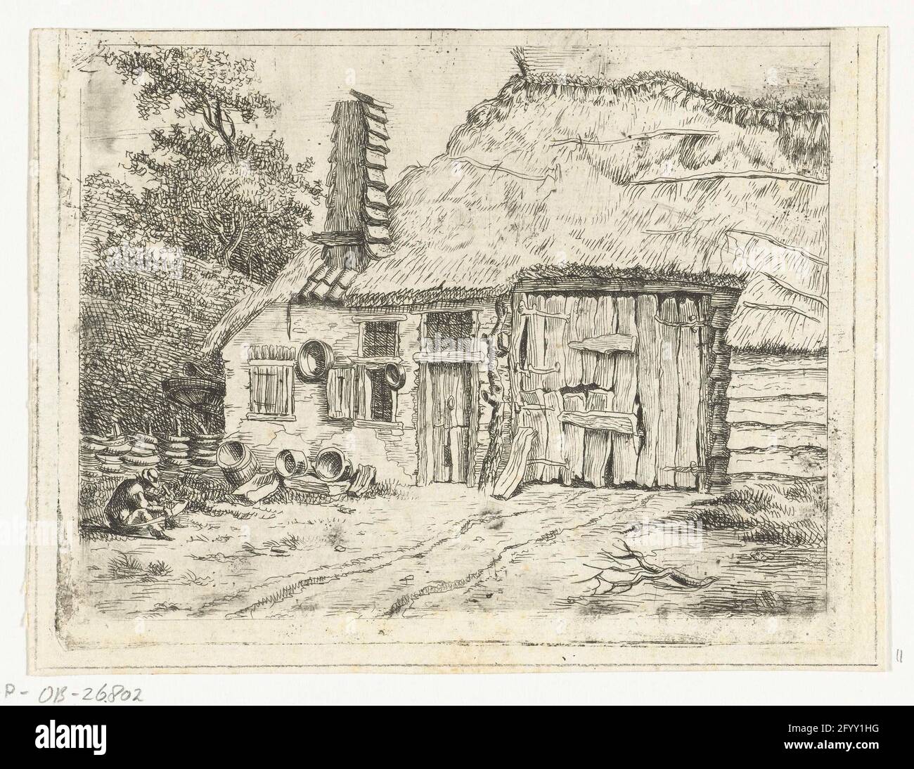 Man sitting working on a zeal for a house; In the country of Drenthe ...