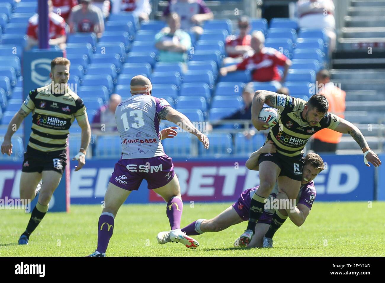 Liam Hood (9) of Leigh Centurions is tackled by Matt Parcell (9) of ...