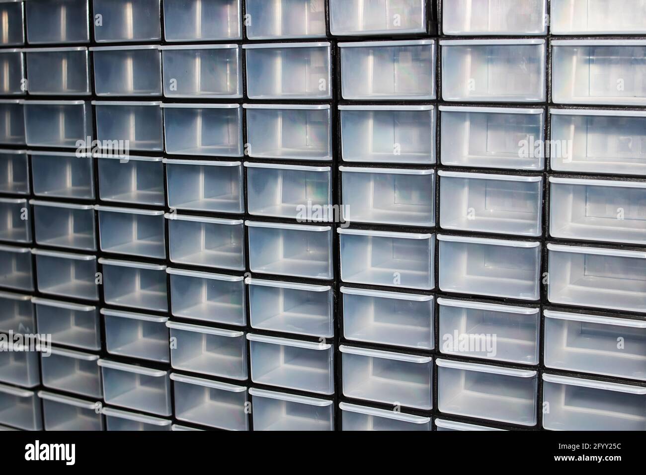Plastic cells in the small change box close up Stock Photo - Alamy