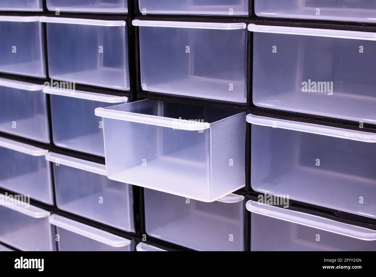 Plastic cells in the small change box close up Stock Photo - Alamy