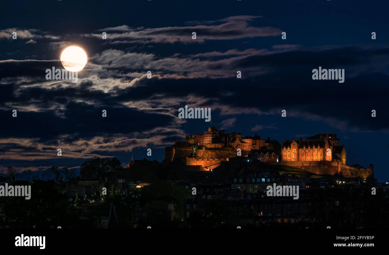 A full moon supermoon rising above the capital city's lit up landmark ...