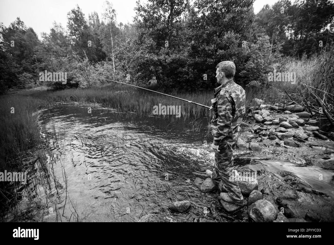 Man catching fish hi-res stock photography and images - Alamy