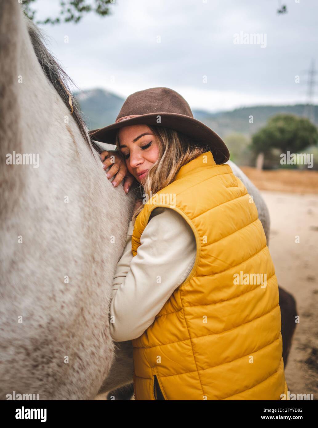 From above of tranquil female with pink hair lying with closed eyes on ...