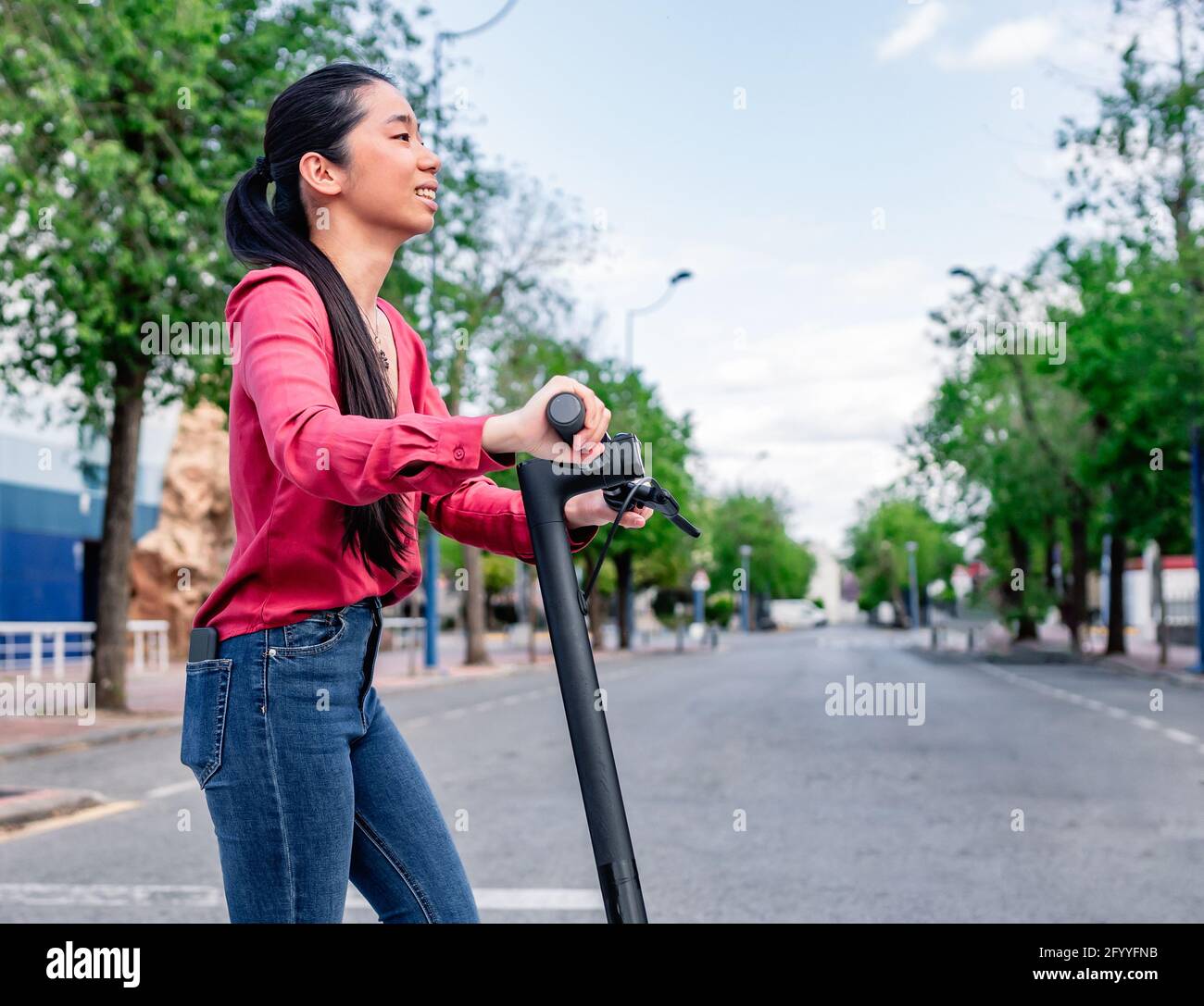 Young asian woman riding scooter hi-res stock photography and images ...