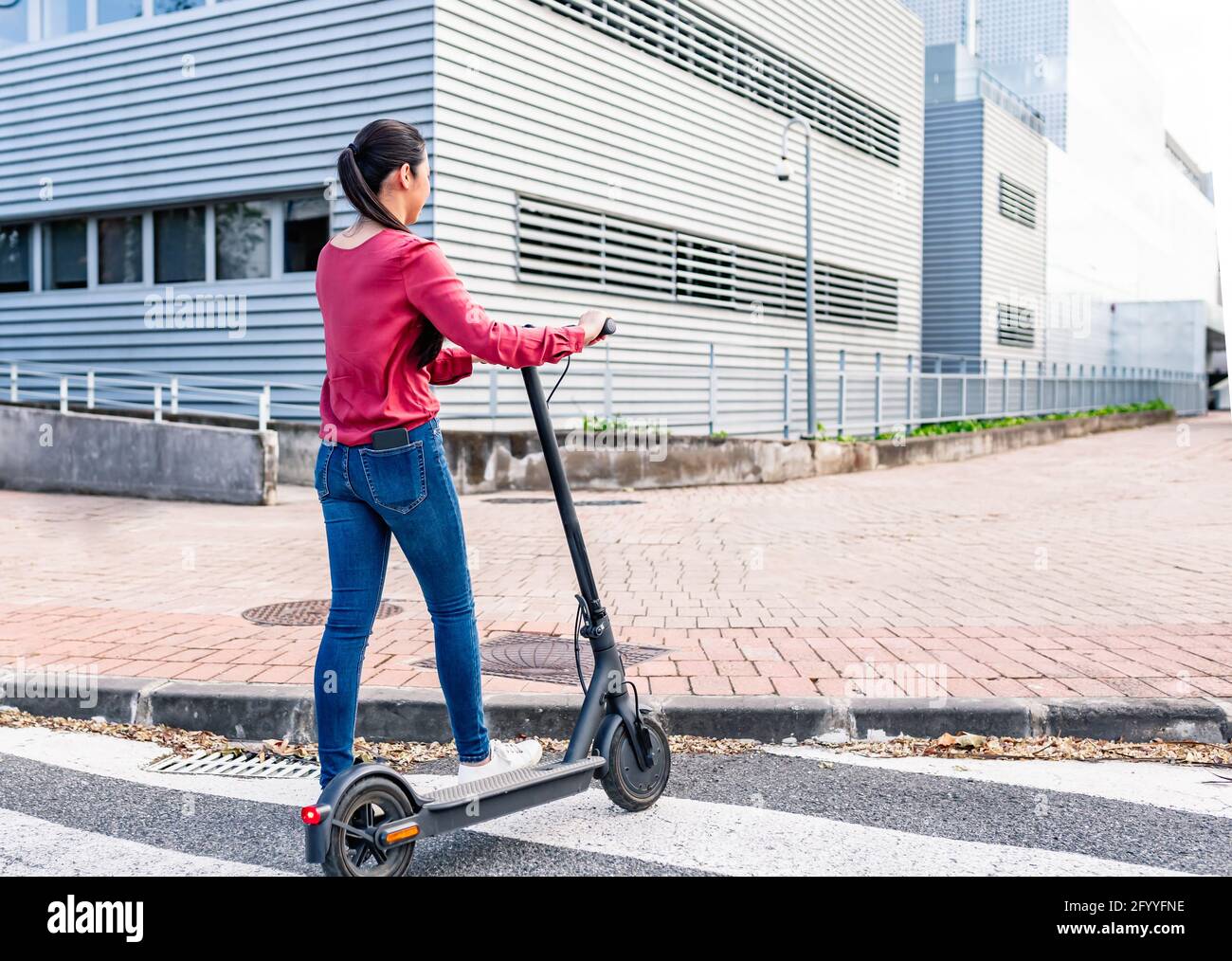Young asian woman riding scooter hi-res stock photography and images ...