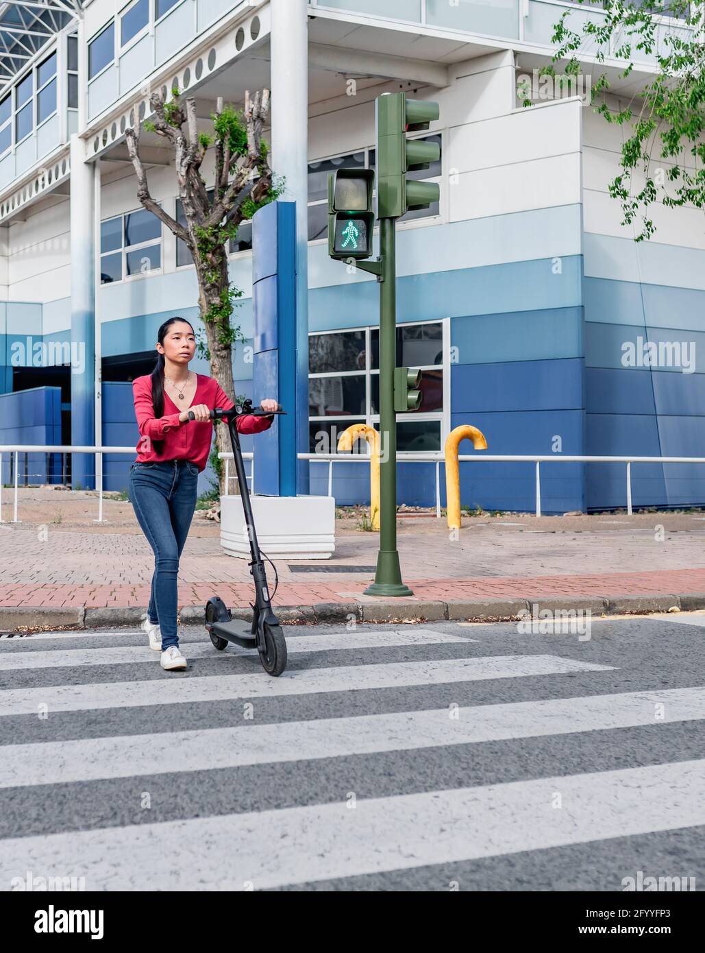 Young asian woman riding scooter hi-res stock photography and images ...