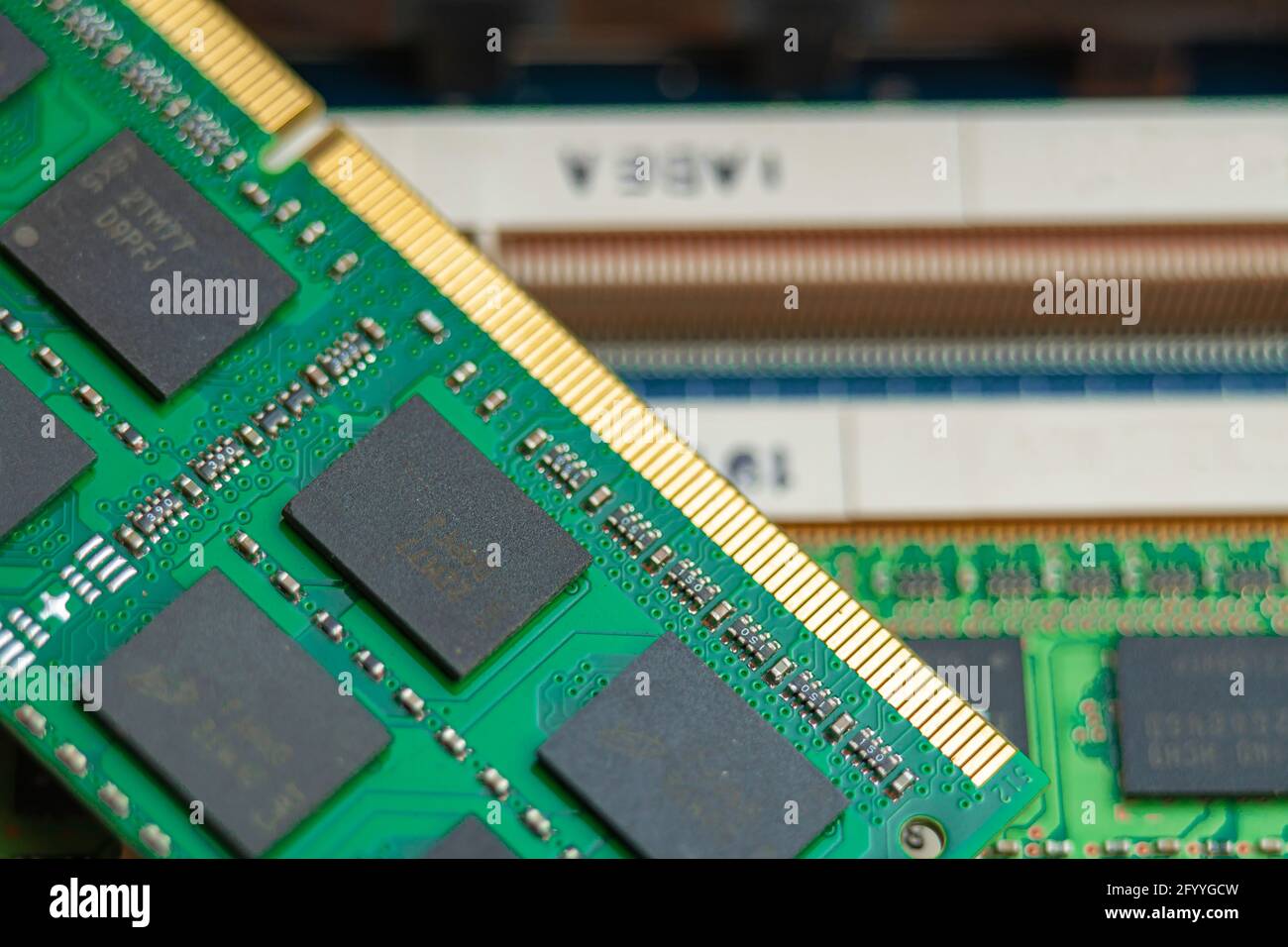 Master holds Laptop RAM close up on motherboard background Stock Photo ...
