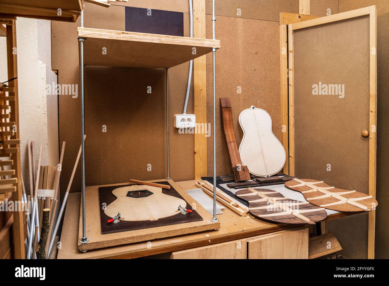 Sound boards of classical musical instruments with clamps and wooden ...