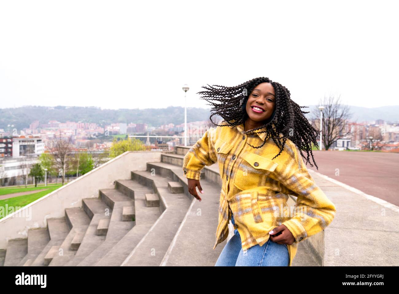 Side view of full body of African American female shaking head while ...