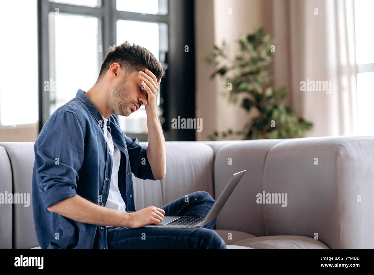 Stressed young freelancer using hi-res stock photography and images - Alamy