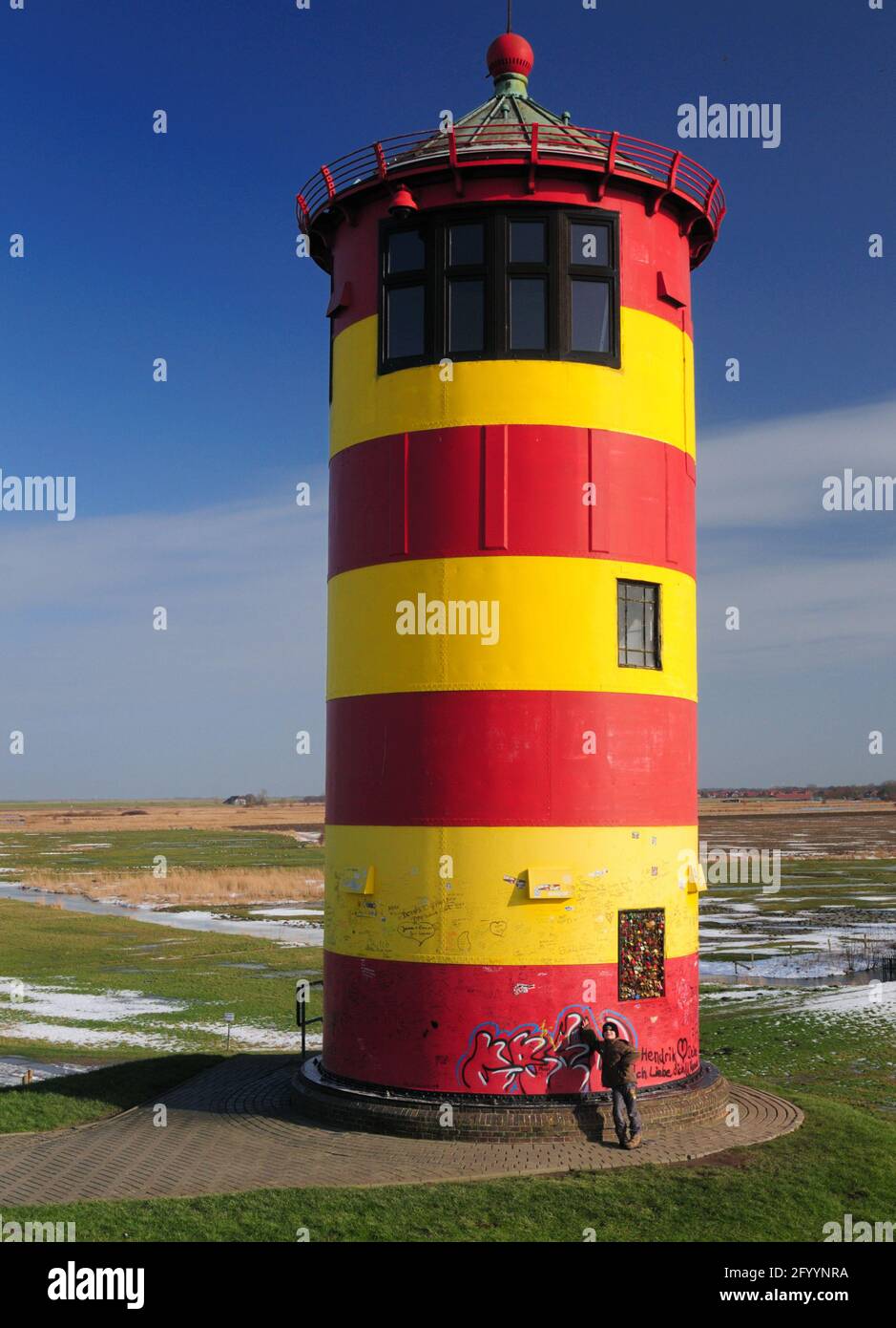 The Famous Red Yellow Lighthouse Of Pilsum In The National Park Wadden ...