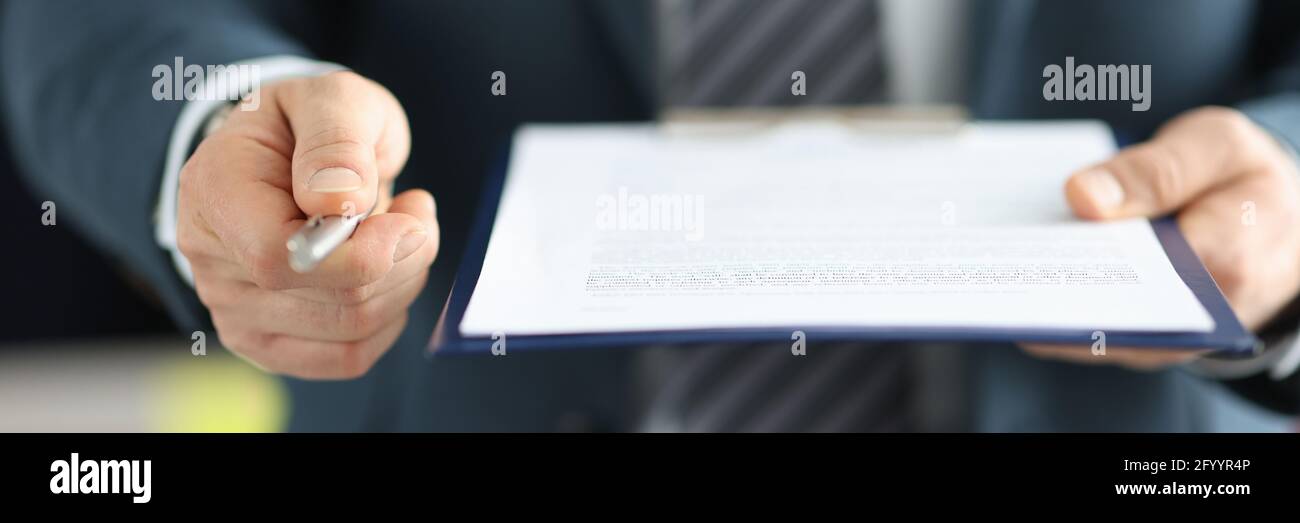 Businessman giving pen client hi-res stock photography and images - Alamy