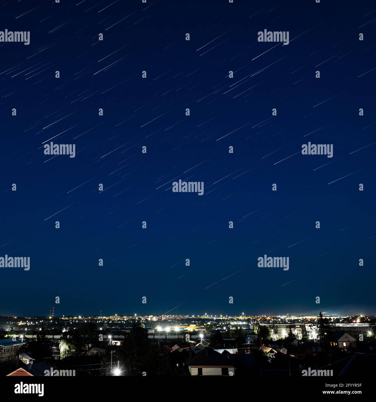 Star trails, movement of stars over a provincial Russian town Stock ...