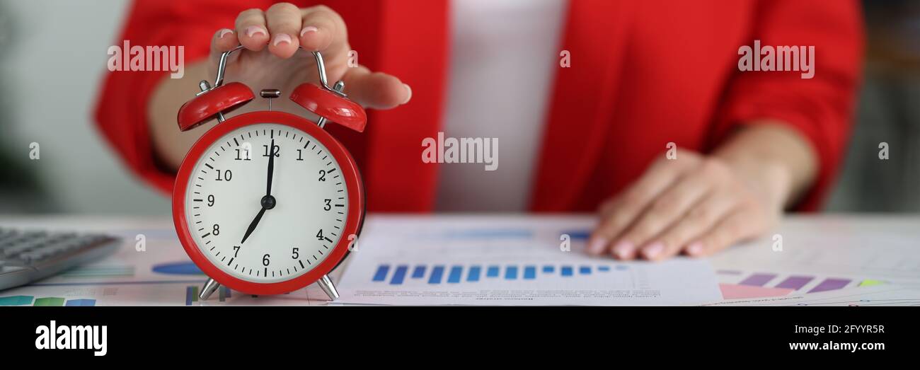 Hand turning off alarm clock hi-res stock photography and images - Alamy
