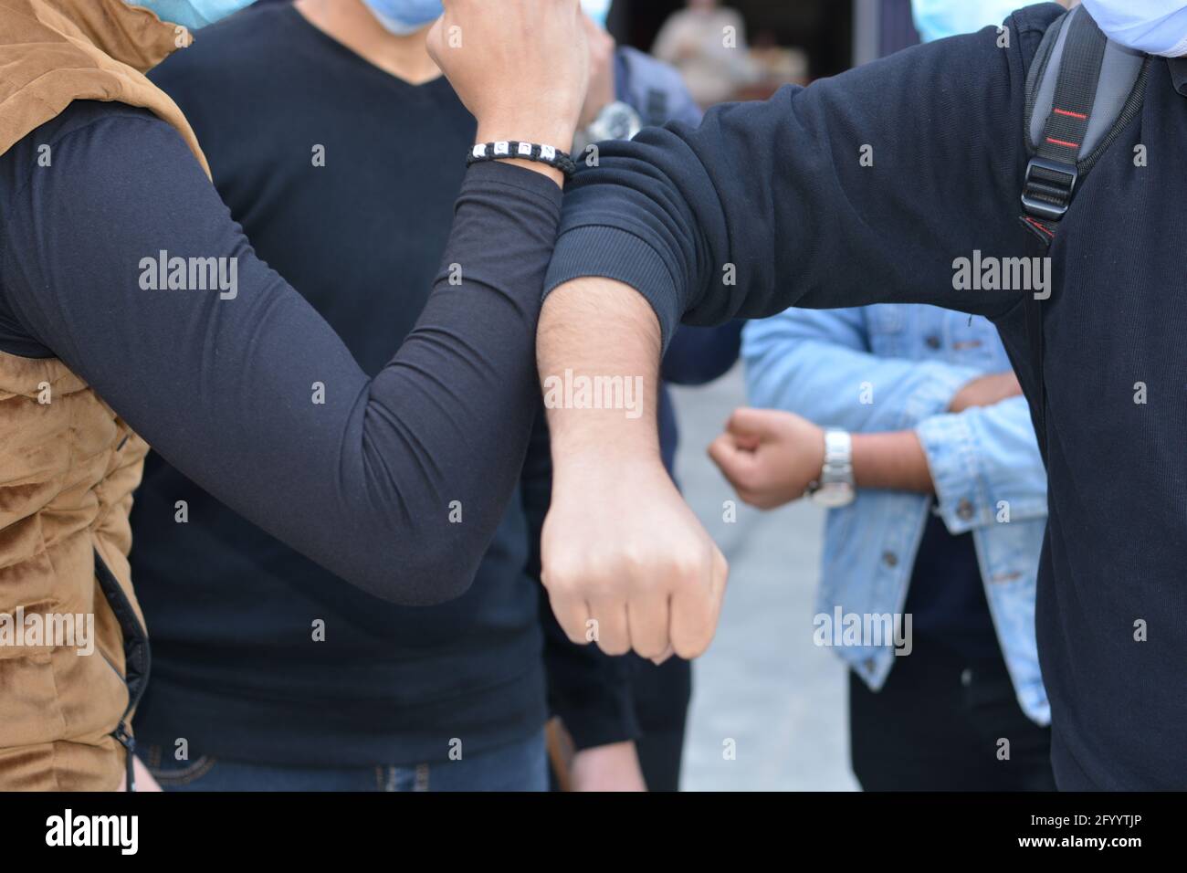 Elbow bump, a new normal and safe way of greeting to avoid the spread ...