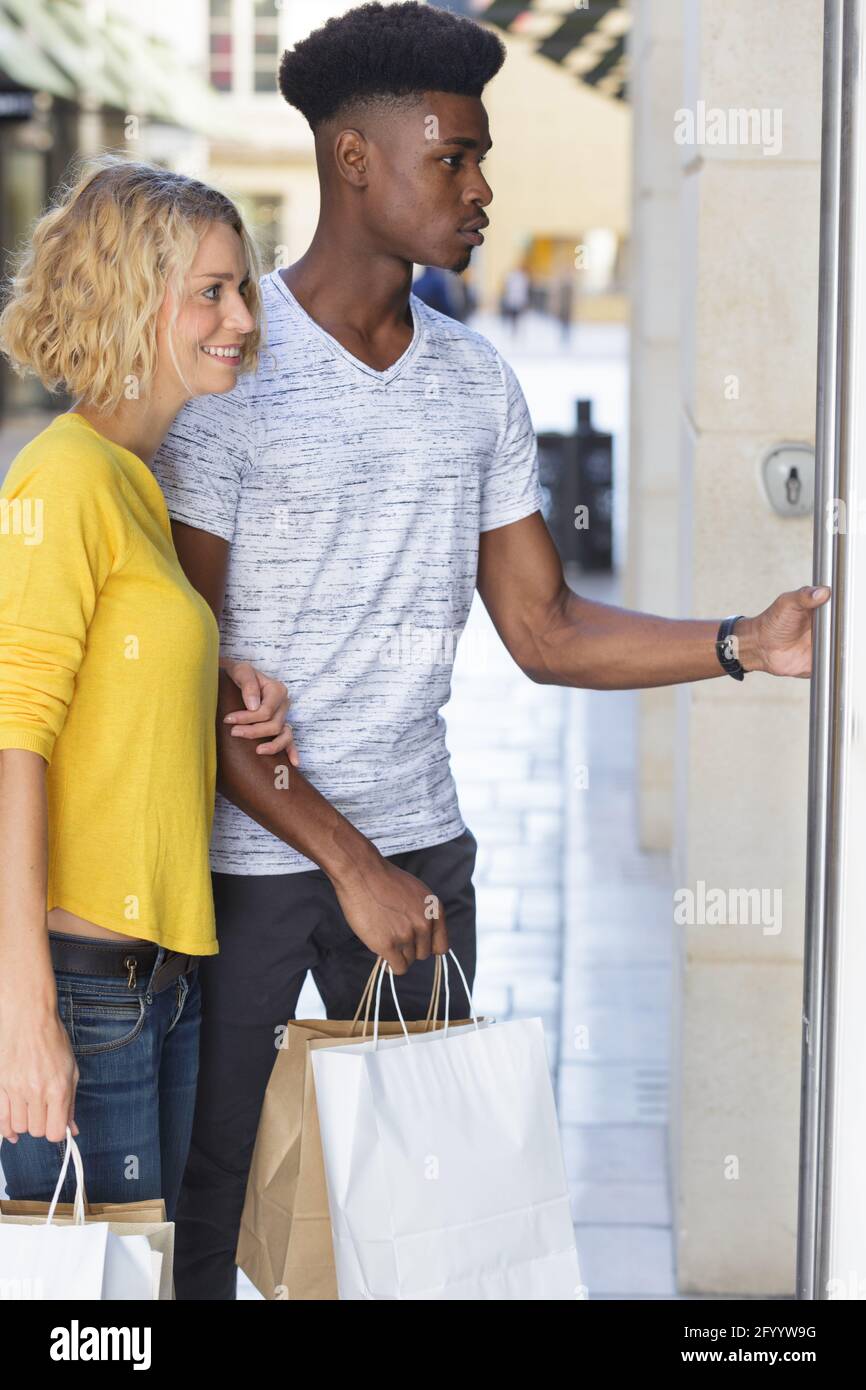 Woman entering shopping mall hi-res stock photography and images - Alamy