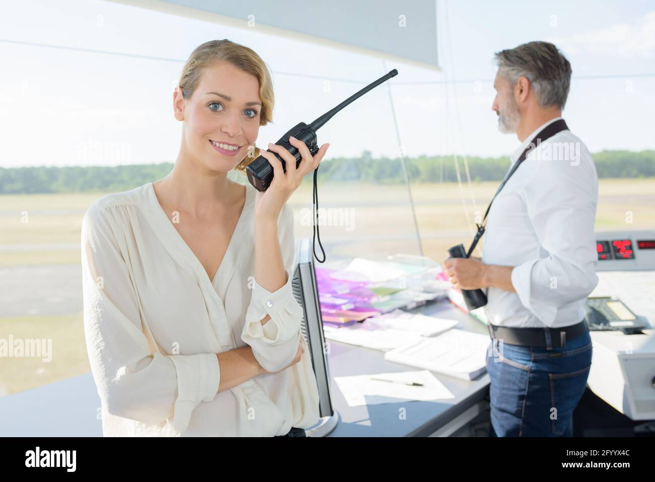 beautiful security guard using a walkie talkie Stock Photo - Alamy