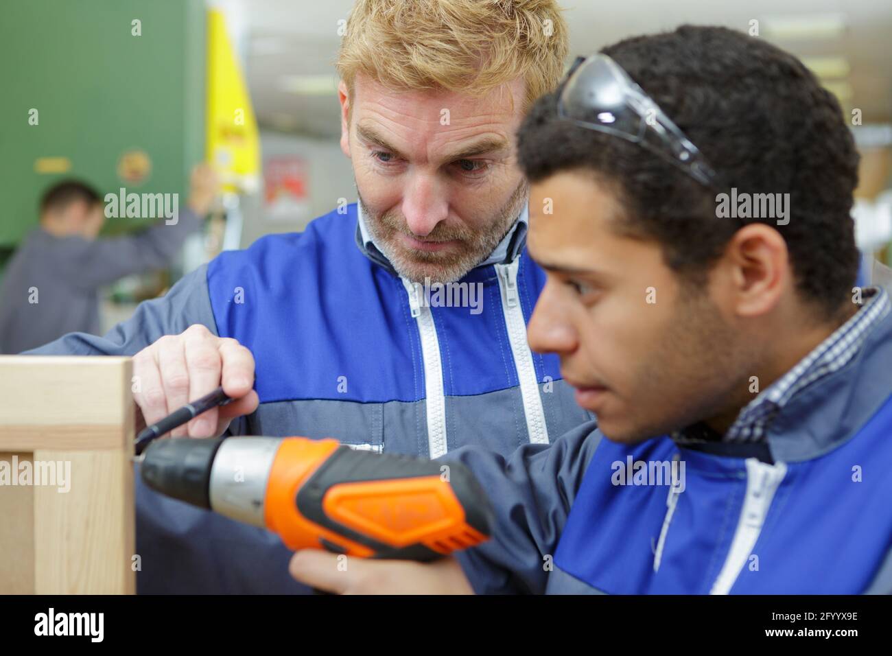 man drilling wood with cordless drill Stock Photo - Alamy