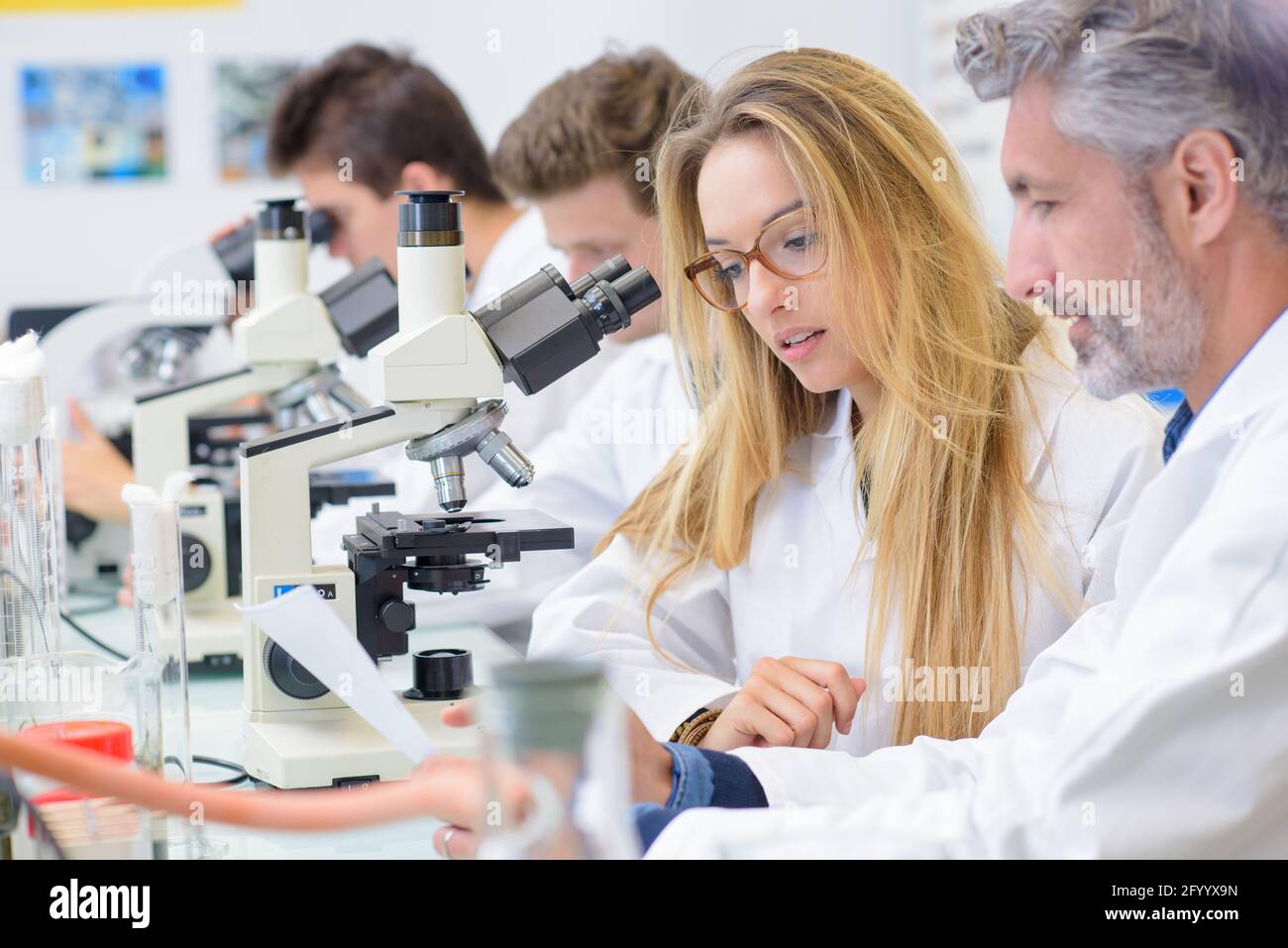 student and teacher in science lab Stock Photo - Alamy