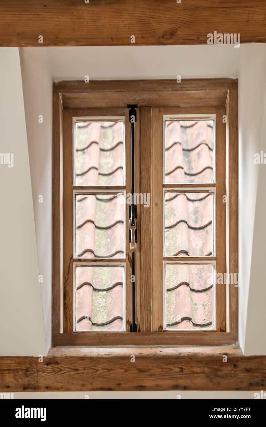 A small window on the ceiling in a room Stock Photo - Alamy