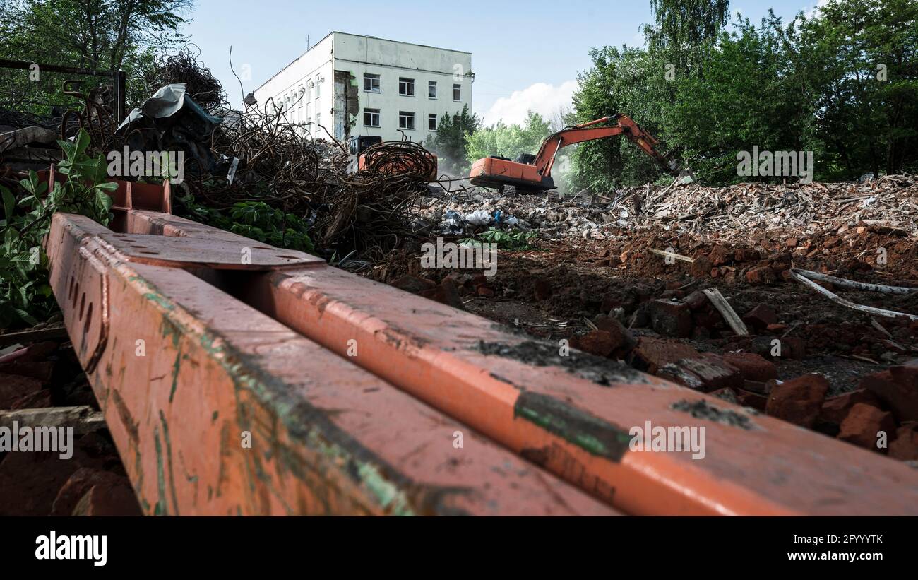 Excavators demolish the building. Dismantling of construction Stock ...