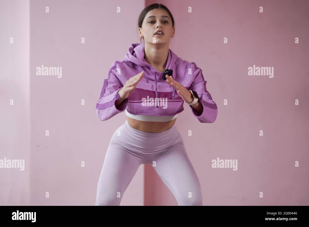 Beautiful girl wearing fashion sportswear doing exercise at gym Stock ...